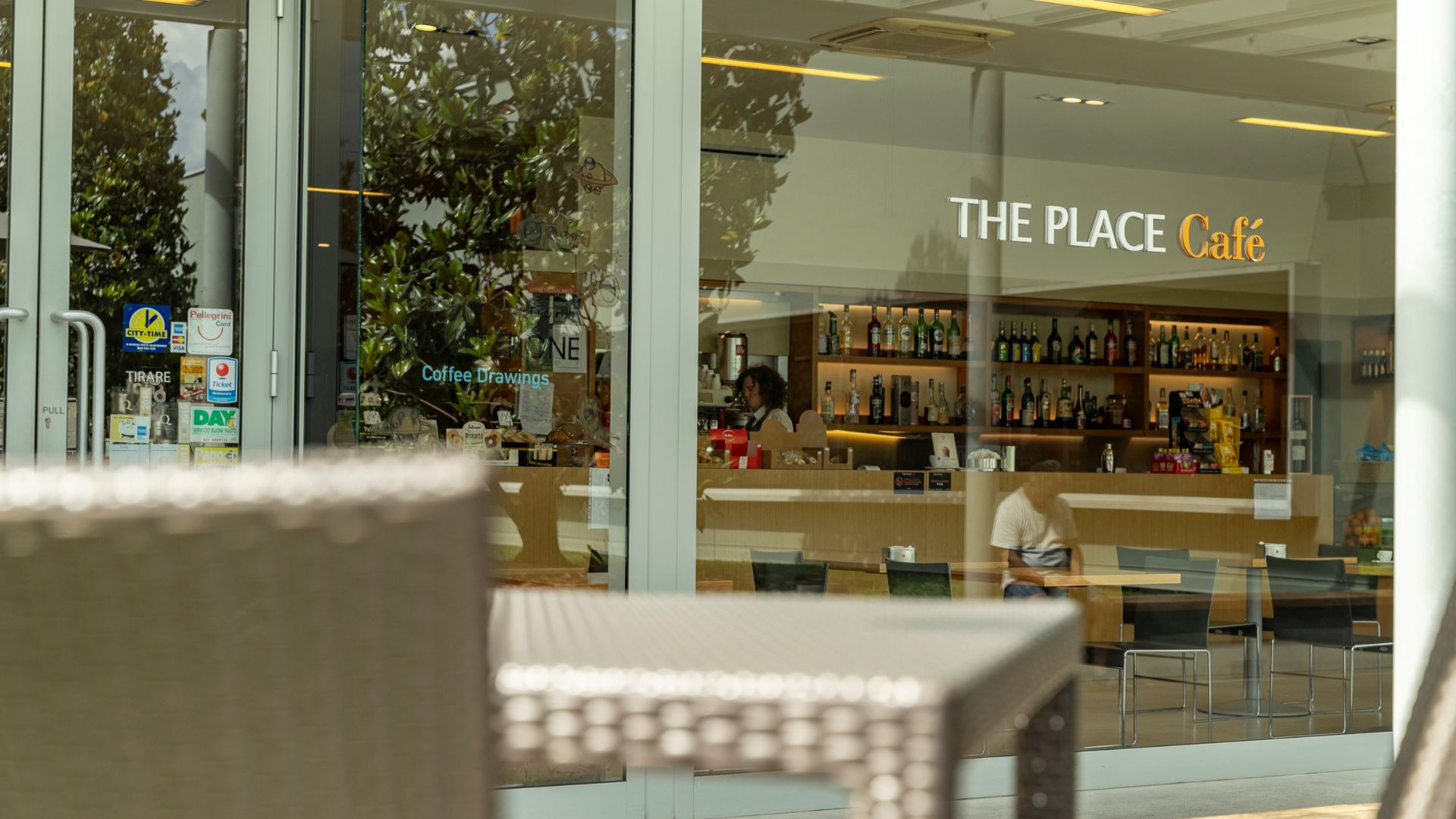 Relax in the cool shade in the dehor of The Place Cafè.